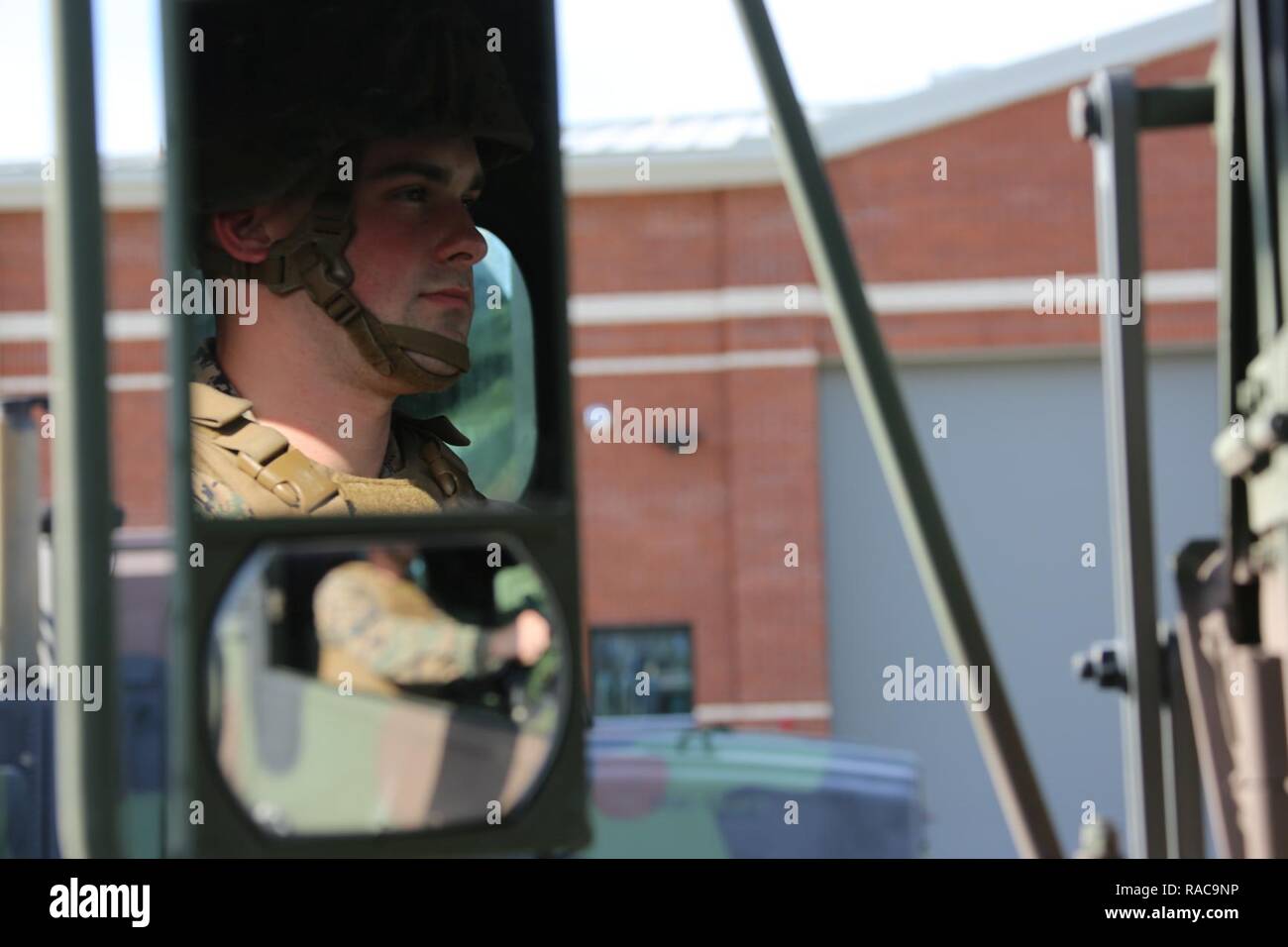 Cpl. Jimmy Moretz operates an MK28 extended cargo truck aboard Marine ...
