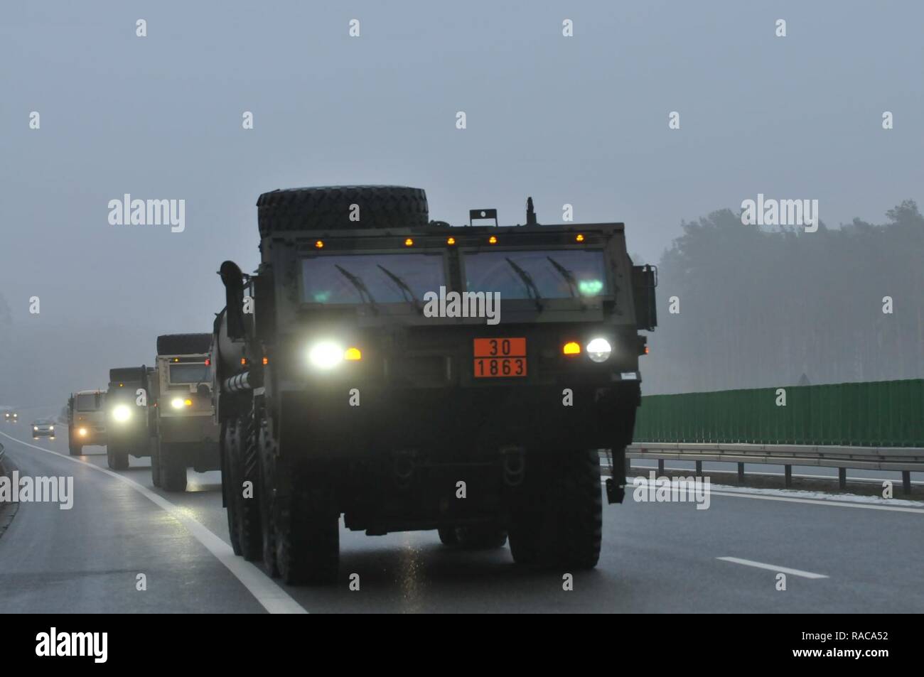 A U.S. Army convoy from Company A, 64th Brigade Support Battalion, 3rd ...