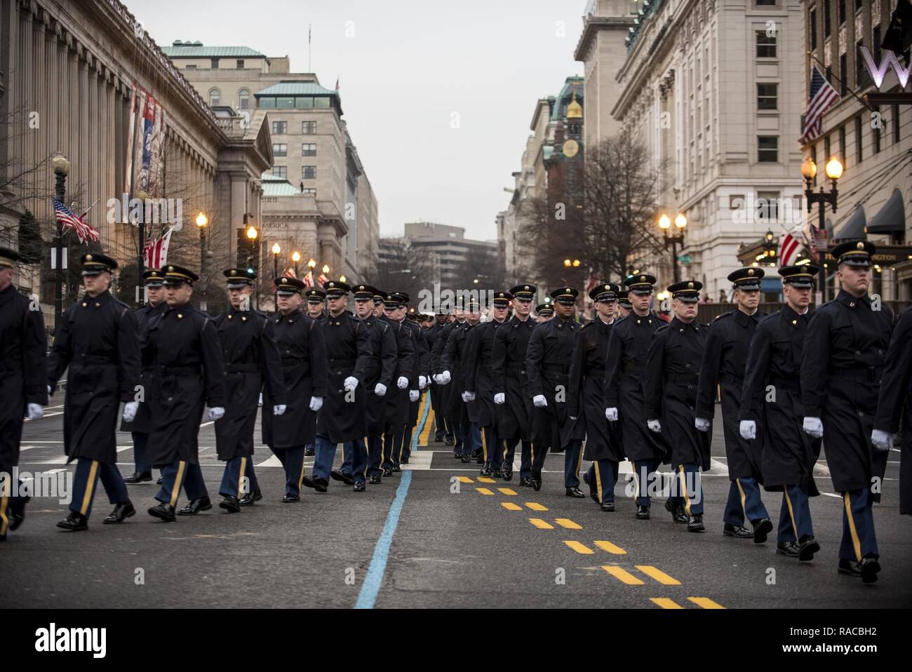 A formation of U.S. Army Soldiers splits out to the sides to allow ...