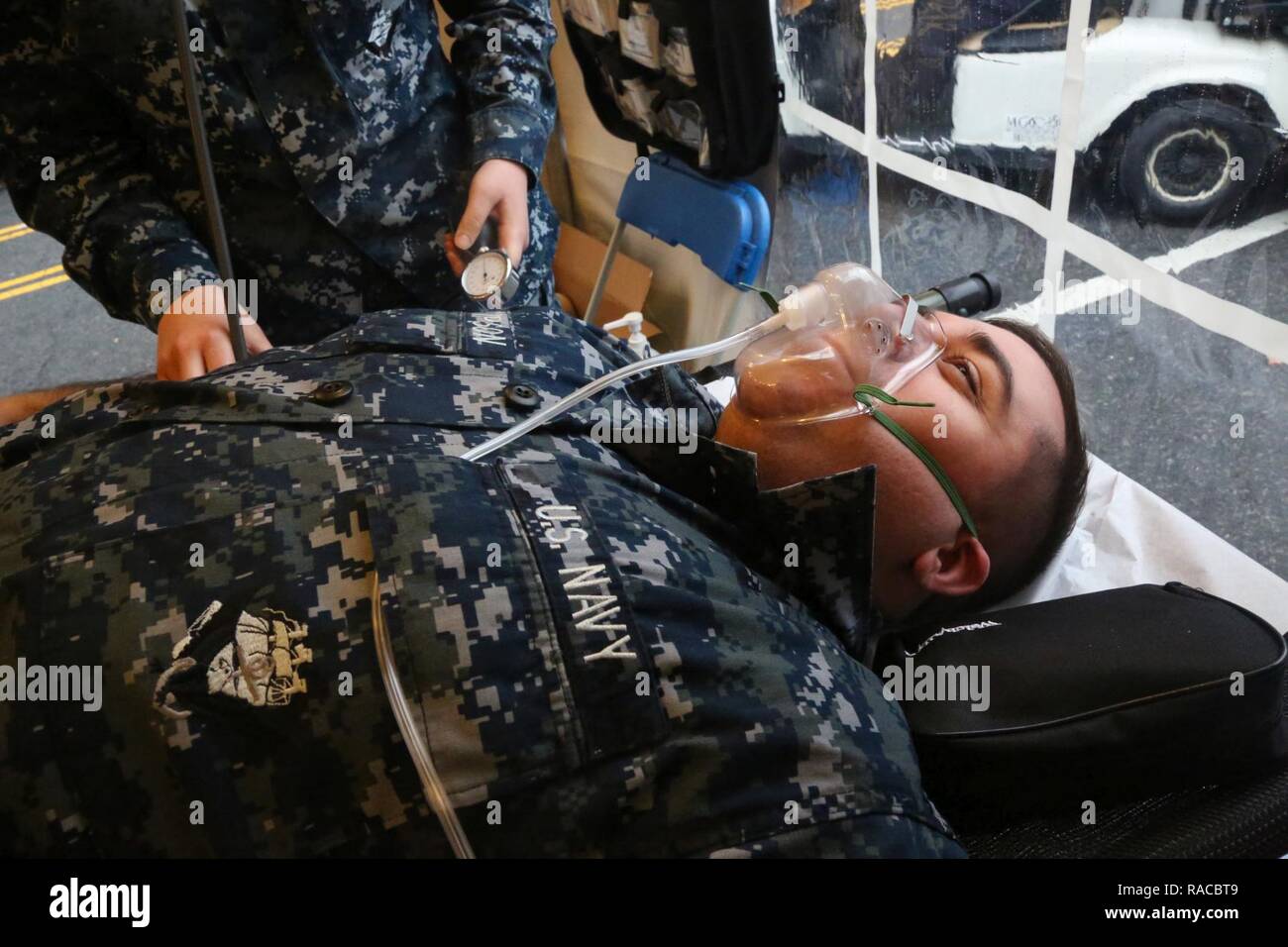 A U.S. Navy Medic assigned to the Walter Reed National Military Medical ...