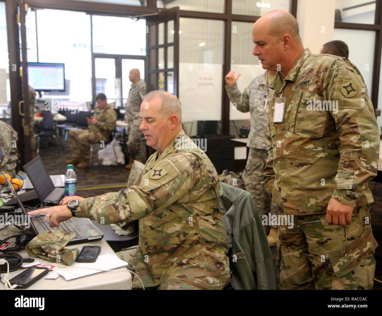 U.S. Army Lt. Col. Edsen Kline, Commander Task Force Crowd, (left) and ...
