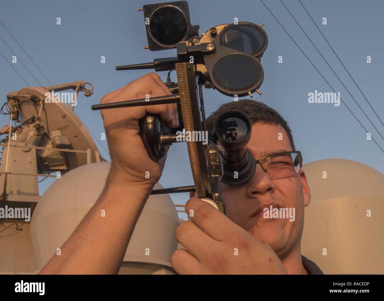 ARABIAN SEA (Jan. 15, 2017) Quartermaster 3rd Class Adam Padilla uses a ...