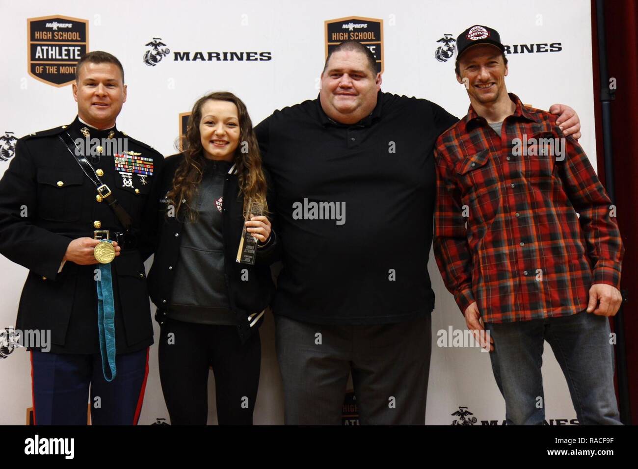 Emma Bruntil stands with Col. Terry M. Johnson, American olympian Rulon ...