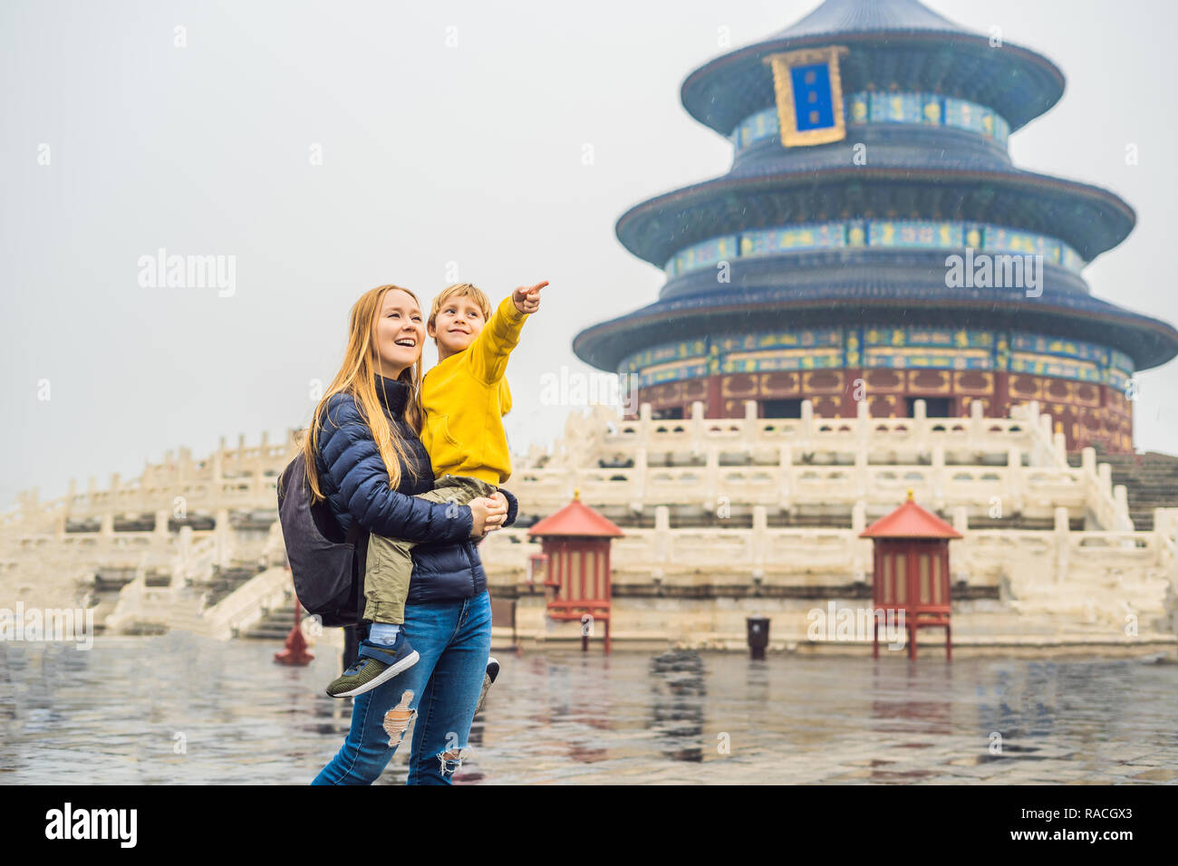 Mom and son travelers in the Temple of Heaven in Beijing. One of the ...