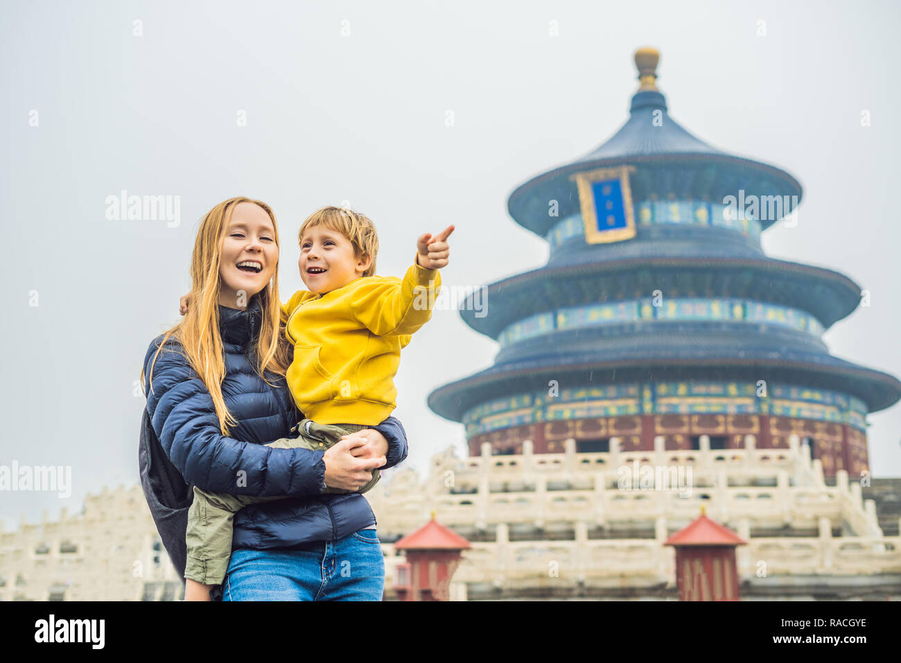 Mom and son travelers in the Temple of Heaven in Beijing. One of the ...