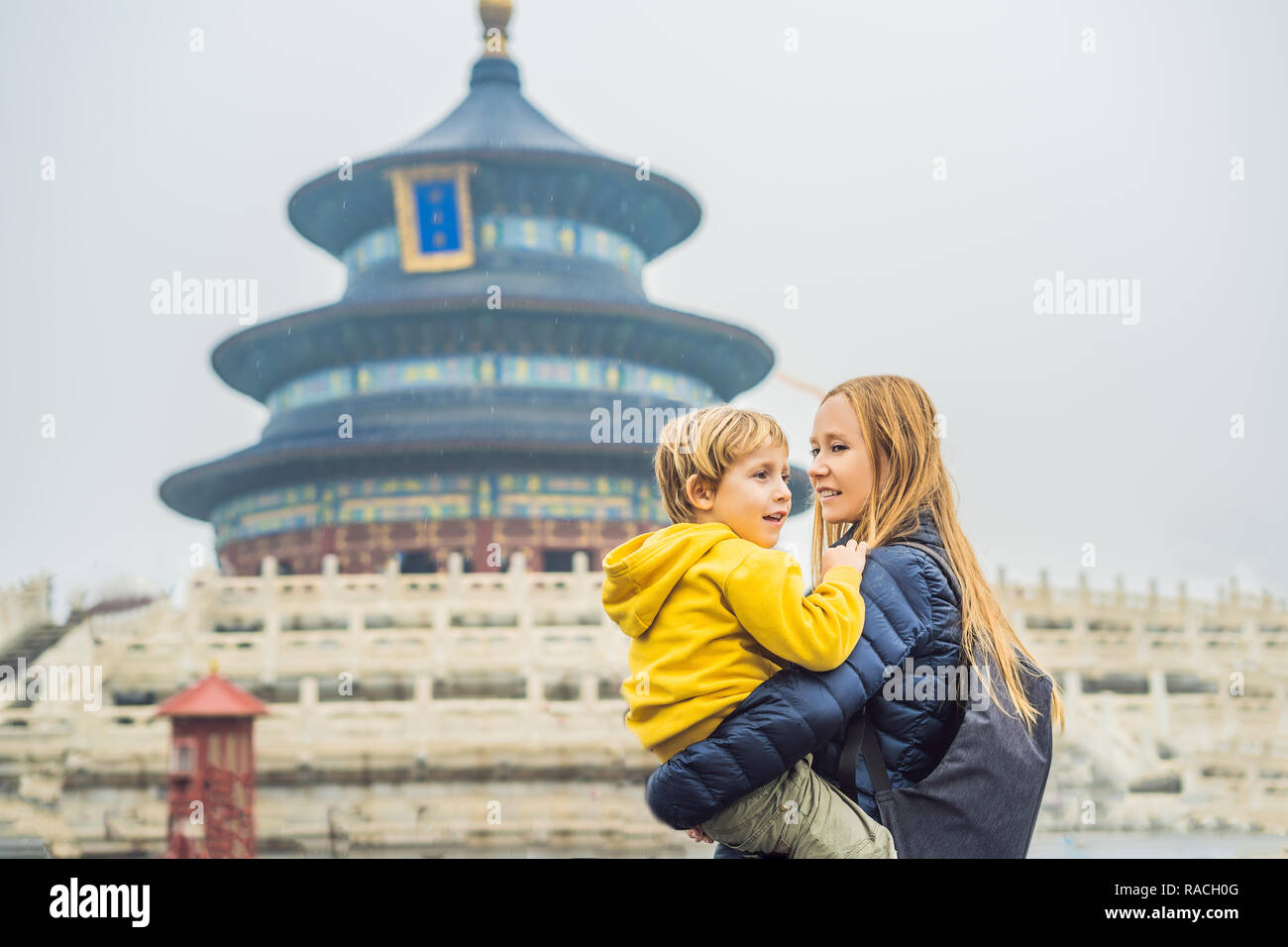 Mom and son travelers in the Temple of Heaven in Beijing. One of the ...