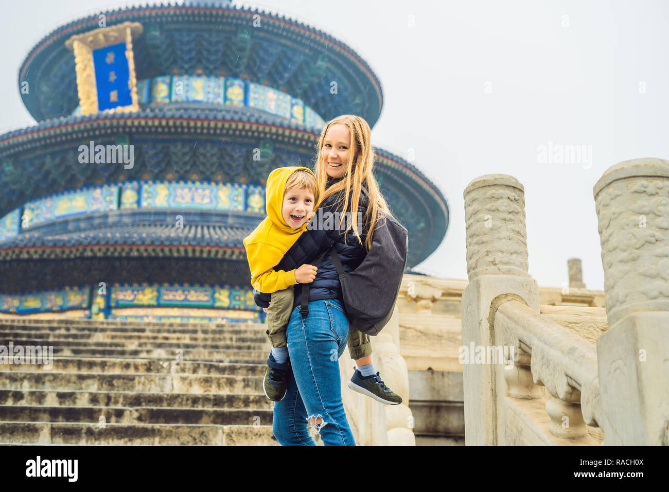 Mom and son travelers in the Temple of Heaven in Beijing. One of the ...