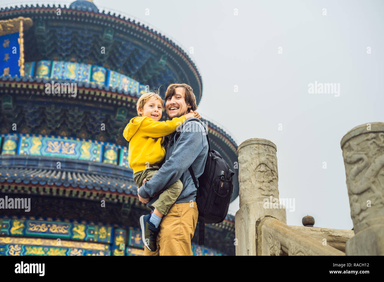 Dad and son travelers in the Temple of Heaven in Beijing. One of the ...