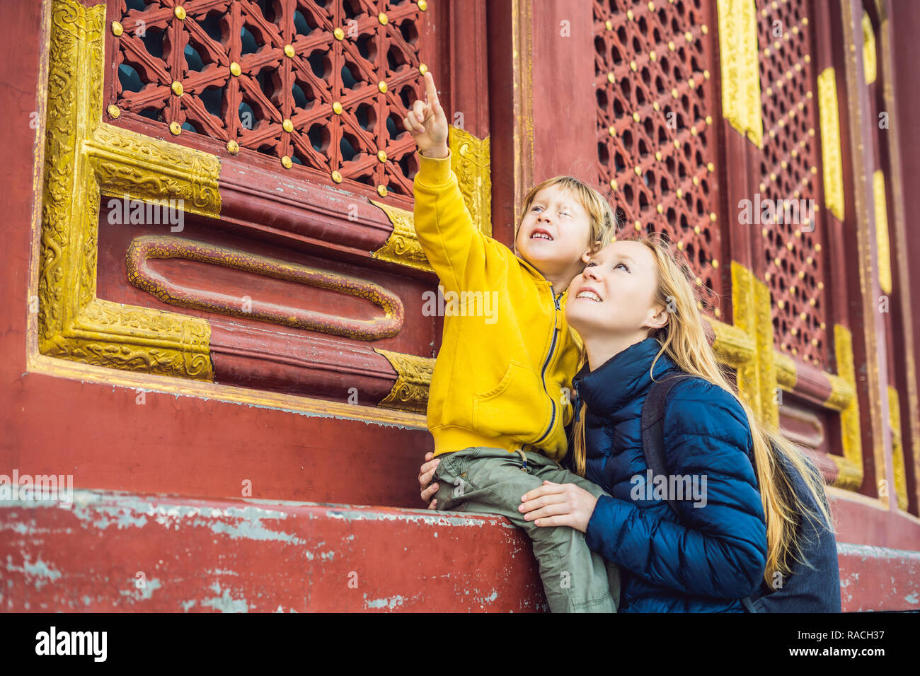 Mom and son travelers in the Temple of Heaven in Beijing. One of the ...
