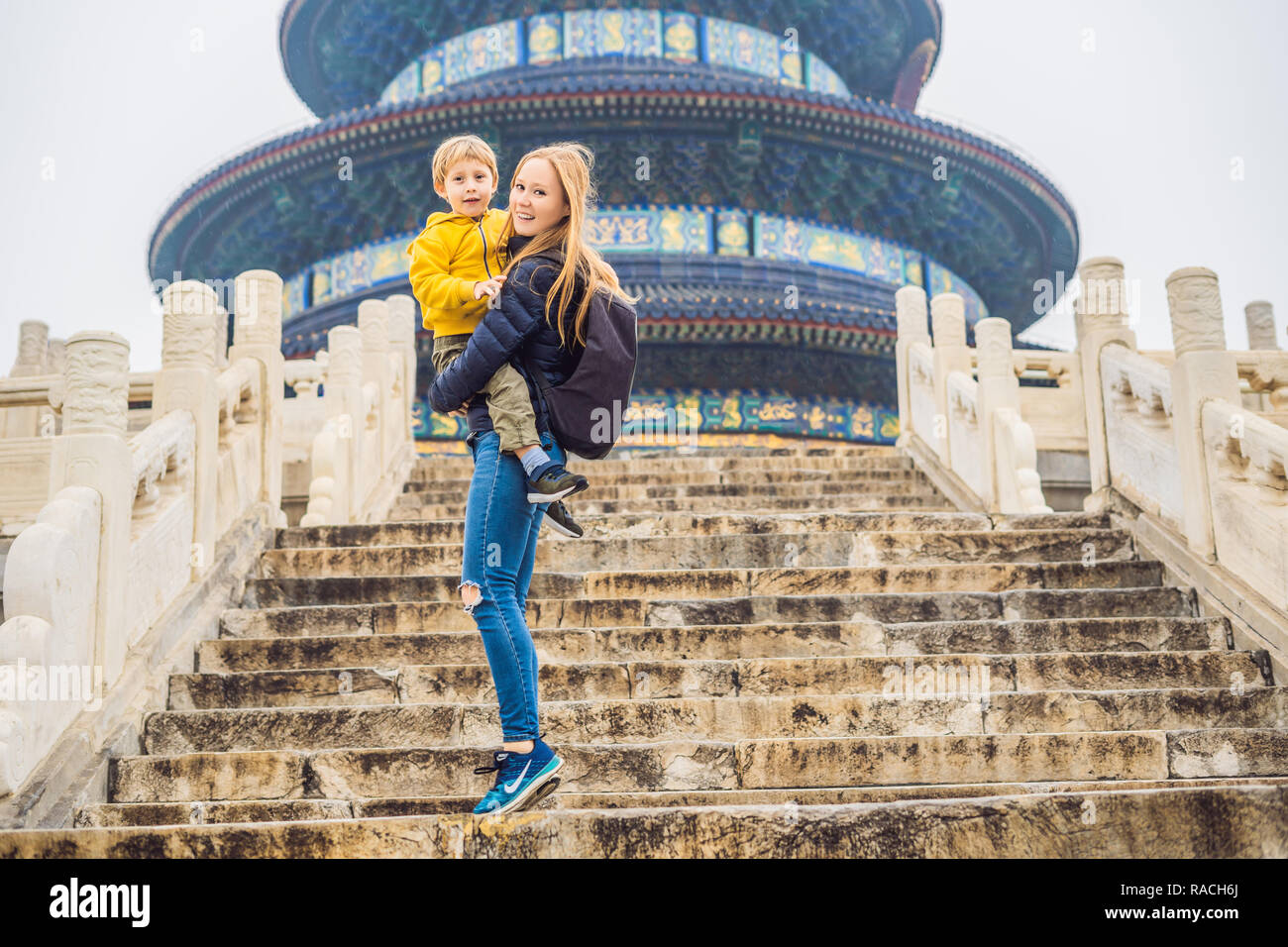 Mom and son travelers in the Temple of Heaven in Beijing. One of the ...