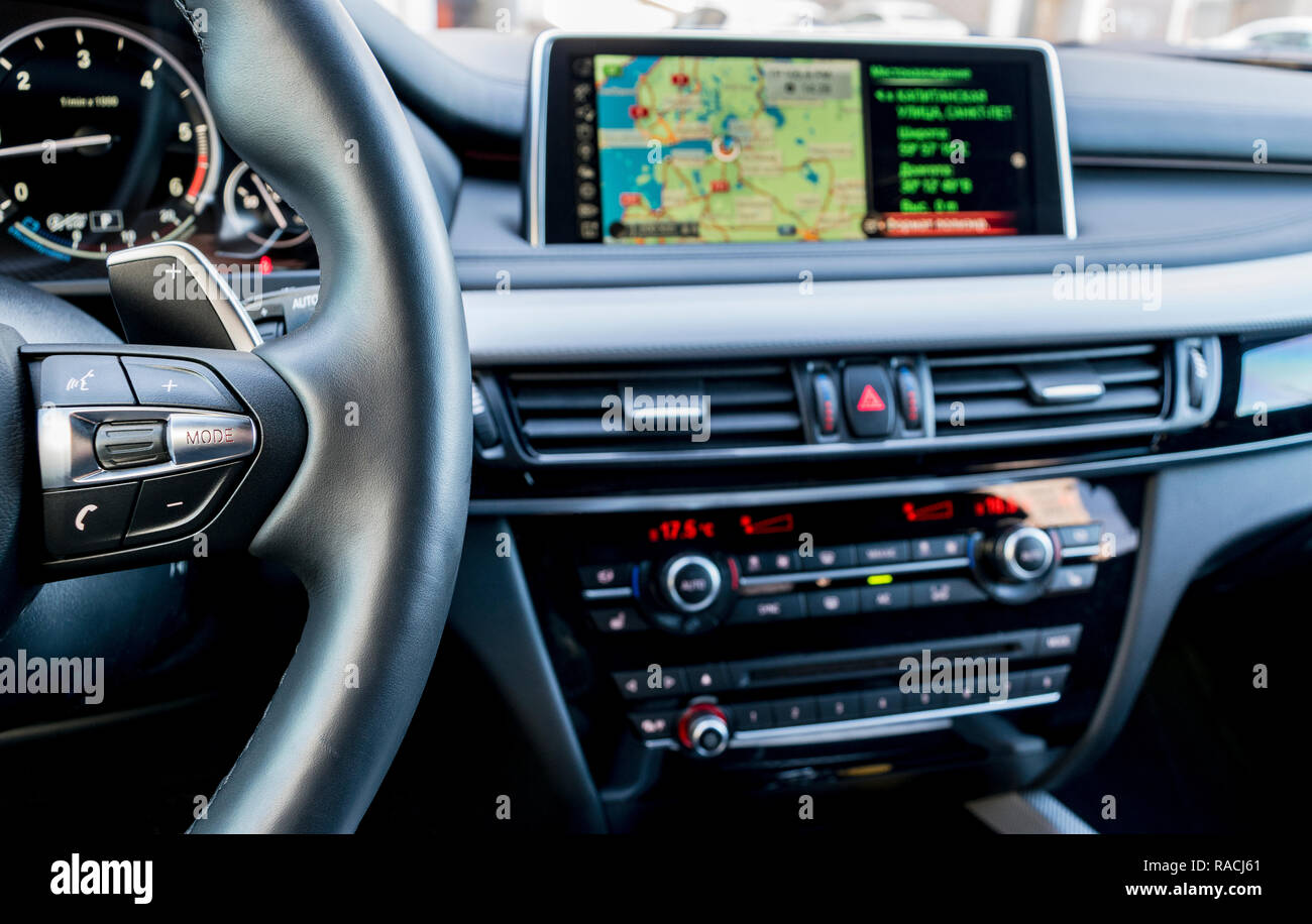 Modern car interior, steering wheel with media phone control buttons ...