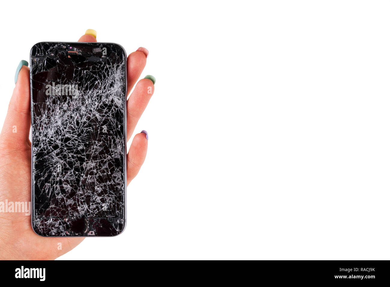 Woman hand holding modern mobile smartphone broken screen and damages ...