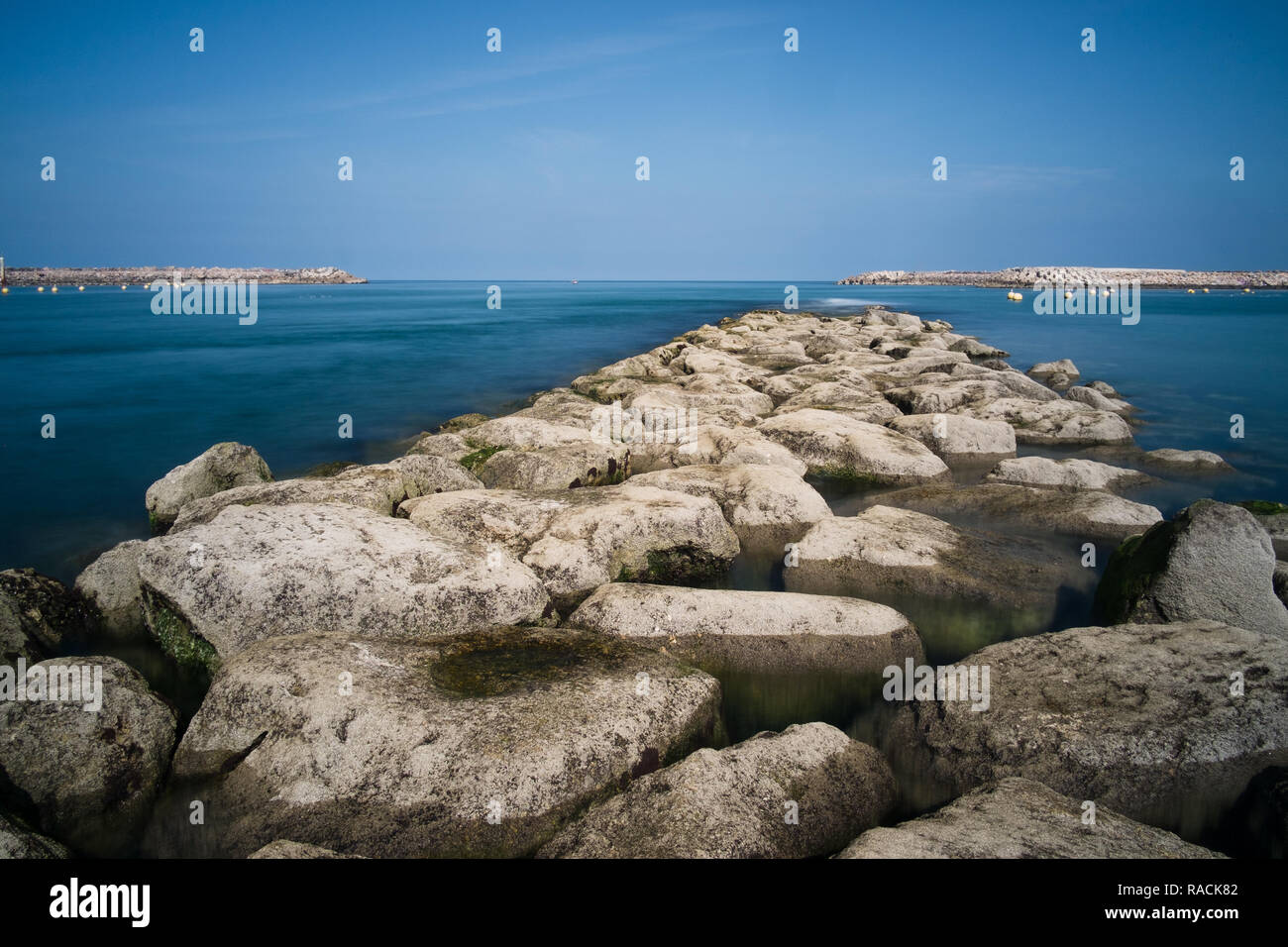 large stones at ocean bay Stock Photo - Alamy