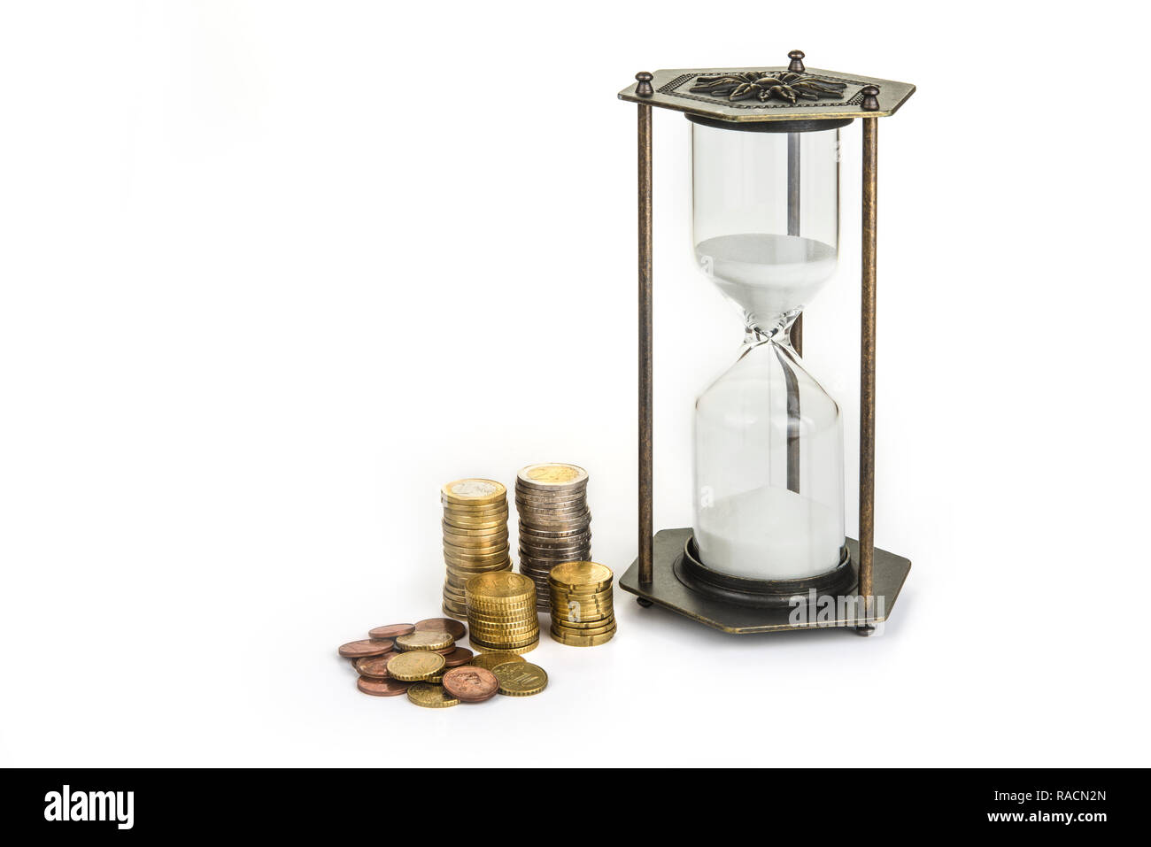 Hourglass clock with coins. Time is money concept Stock Photo - Alamy