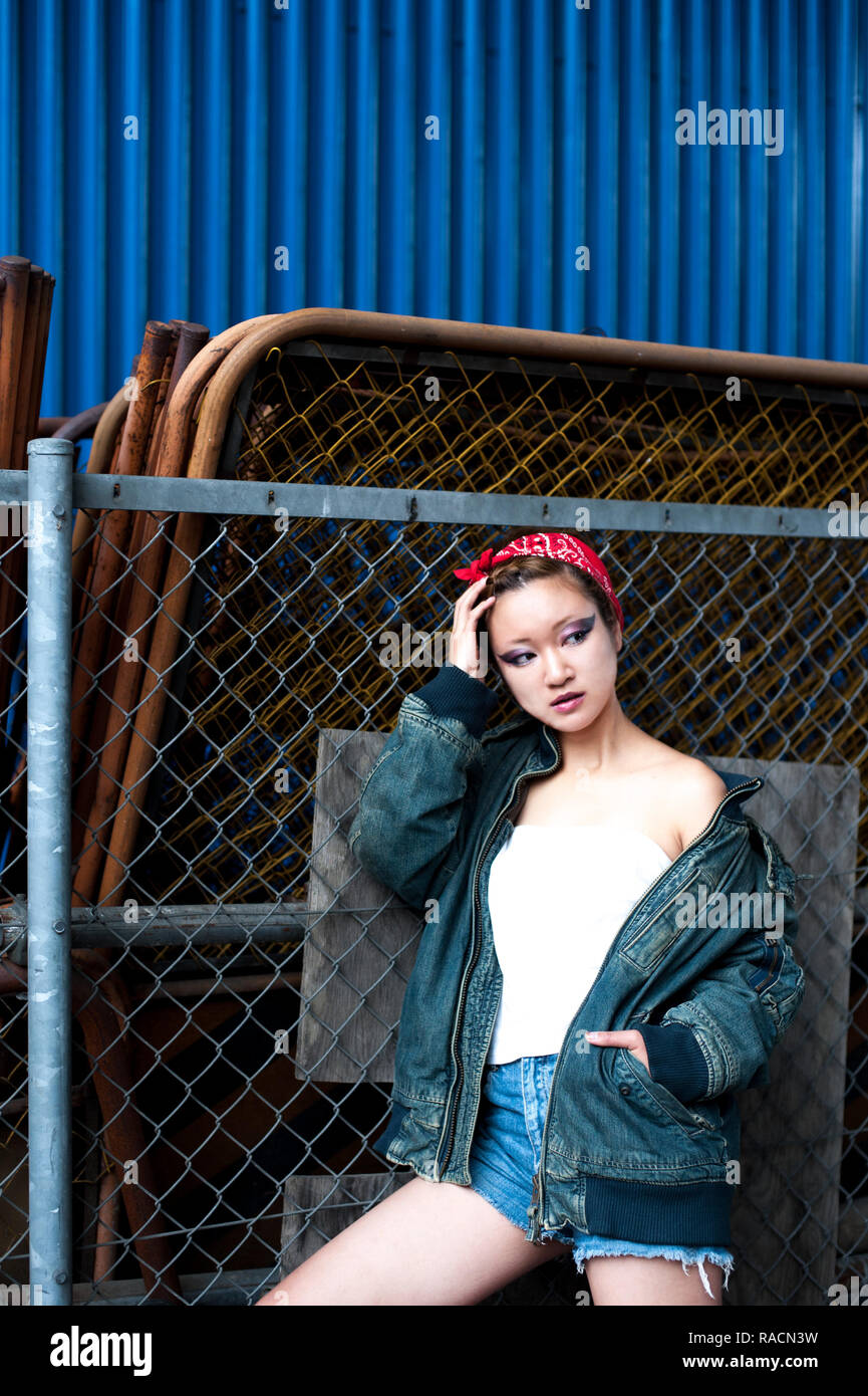 Asian female model poses for pictures on the street Stock Photo - Alamy
