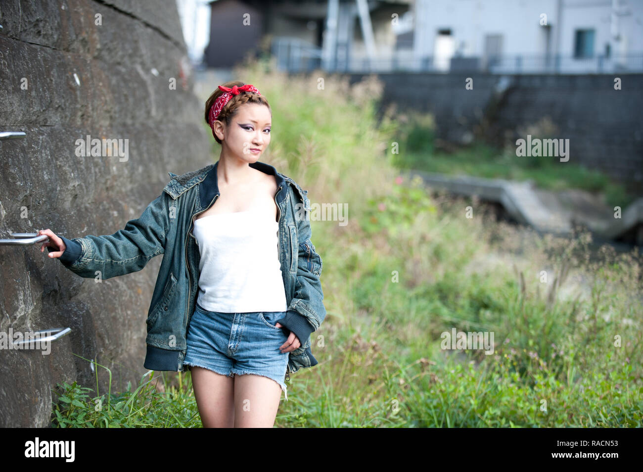 Asian female model poses for pictures on the street Stock Photo - Alamy