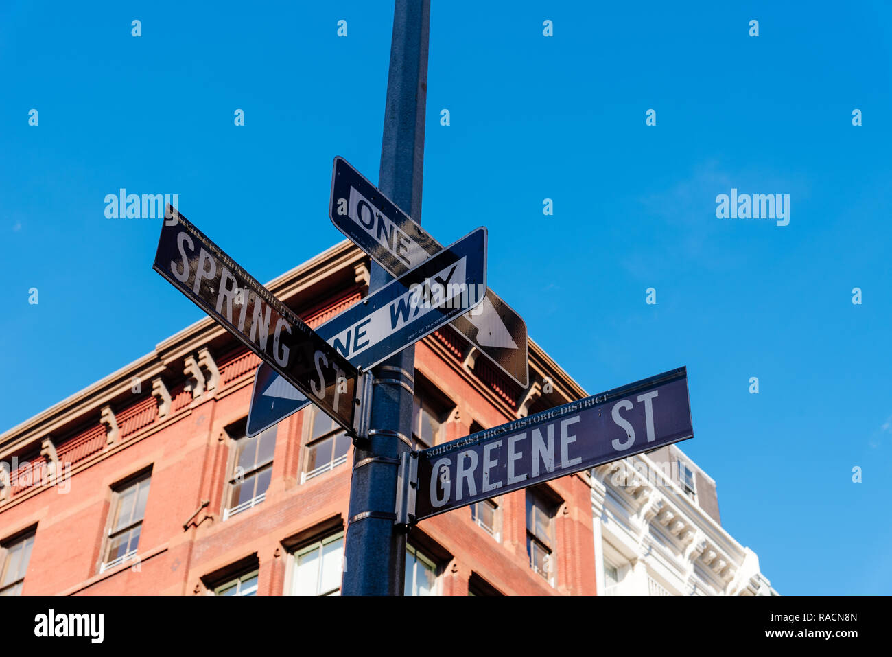 Low angle view of typical building and street name sign in Greene ...