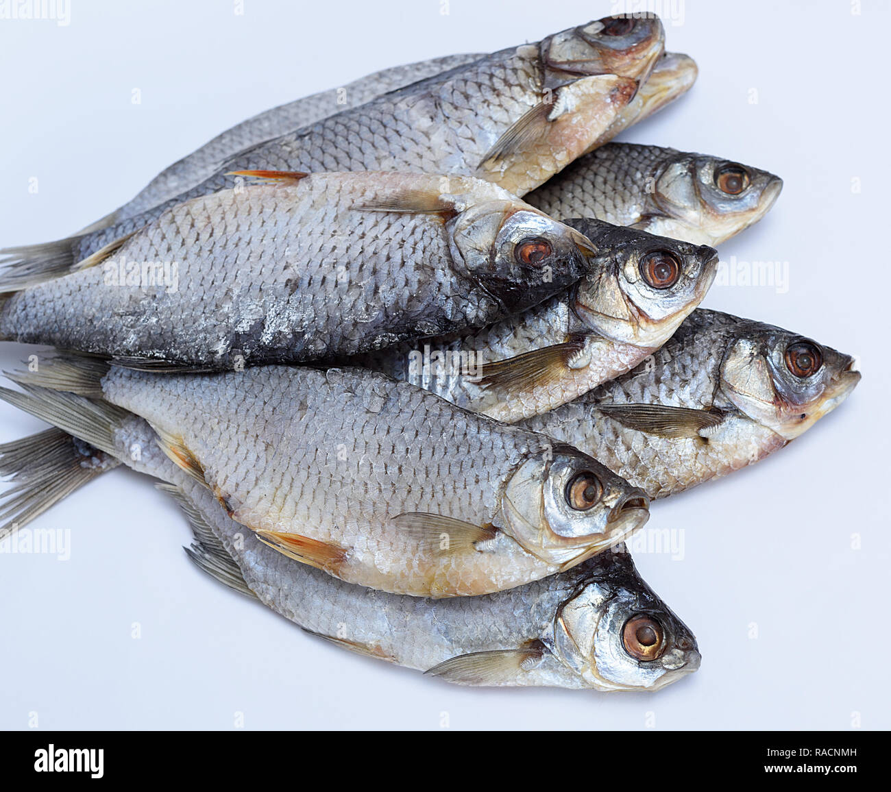 dried fish ram on a white background, close up Stock Photo - Alamy