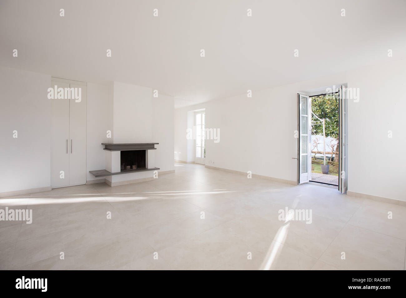 Modern empty wide room, white walls Stock Photo - Alamy