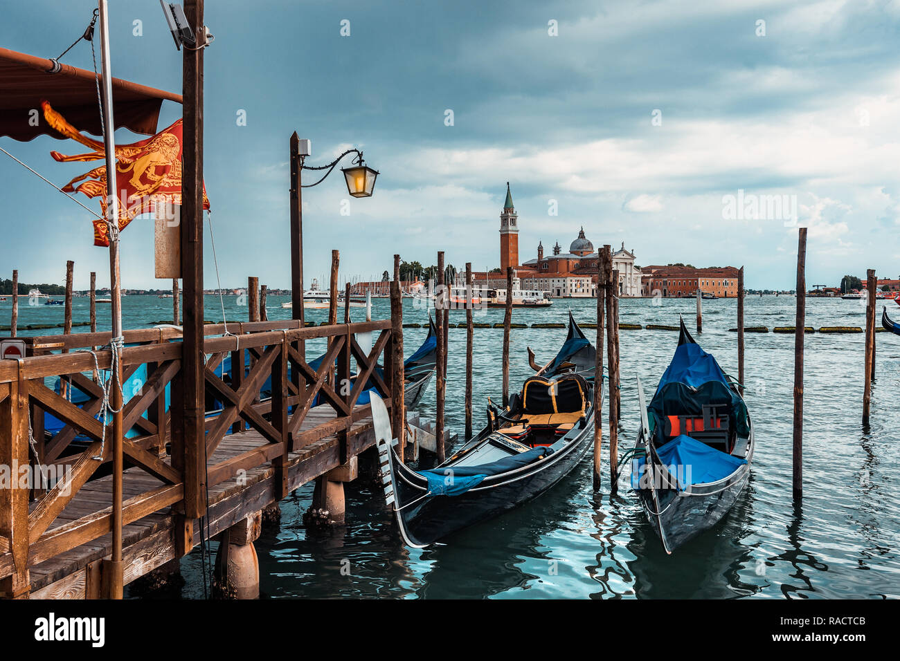 Venice dock with rested gondolas at sunset with a dramatic sky Stock ...