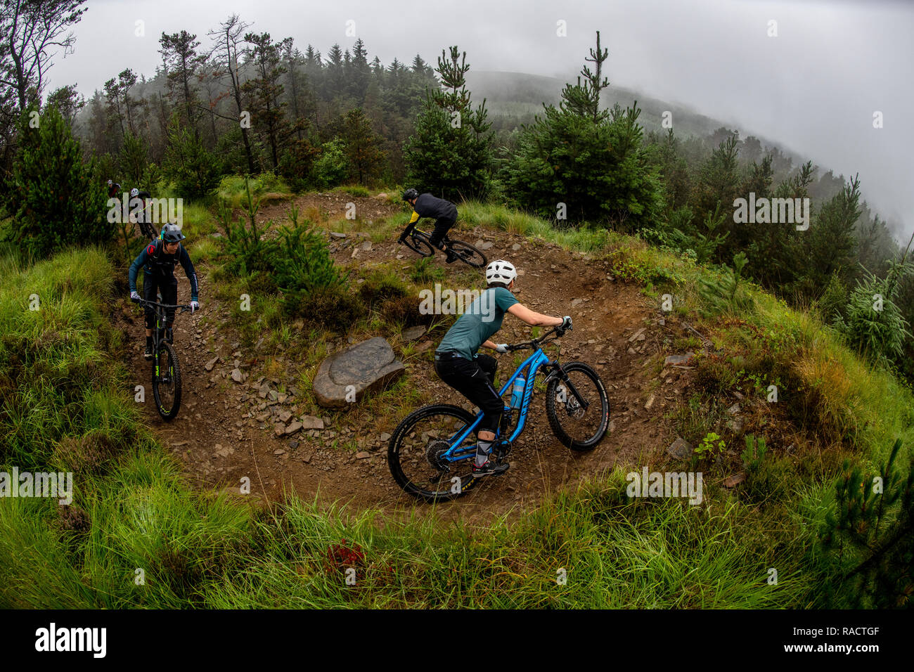 A group of mountain bikers ride a trail at Glyncorrwg in the Afan ...