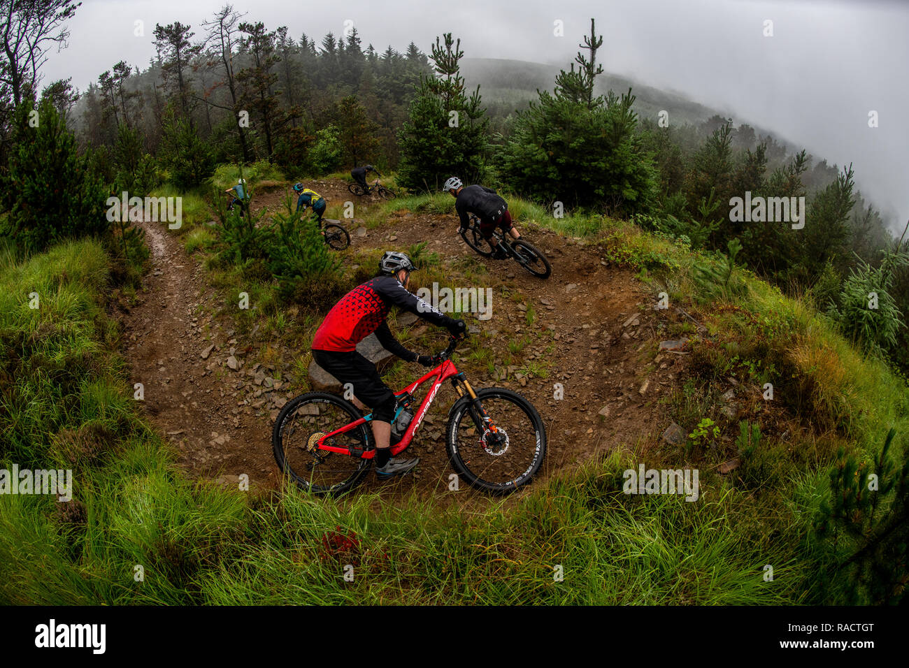 A group of mountain bikers ride a trail at Glyncorrwg in the Afan ...