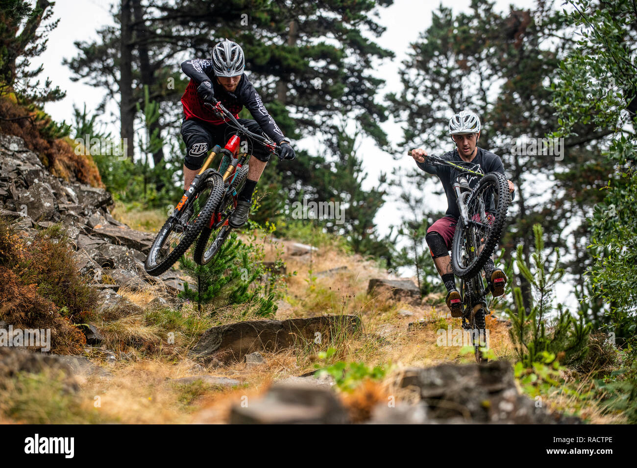 Two mountain bikers ride a rocky a trail at Glyncorrwg in the Afan ...