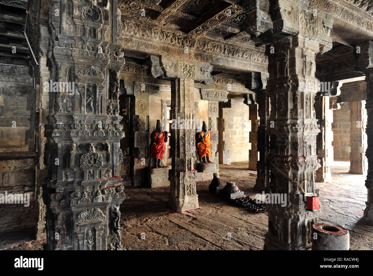 Two dressed deities at shrine inside pillared hall in 11th century ...