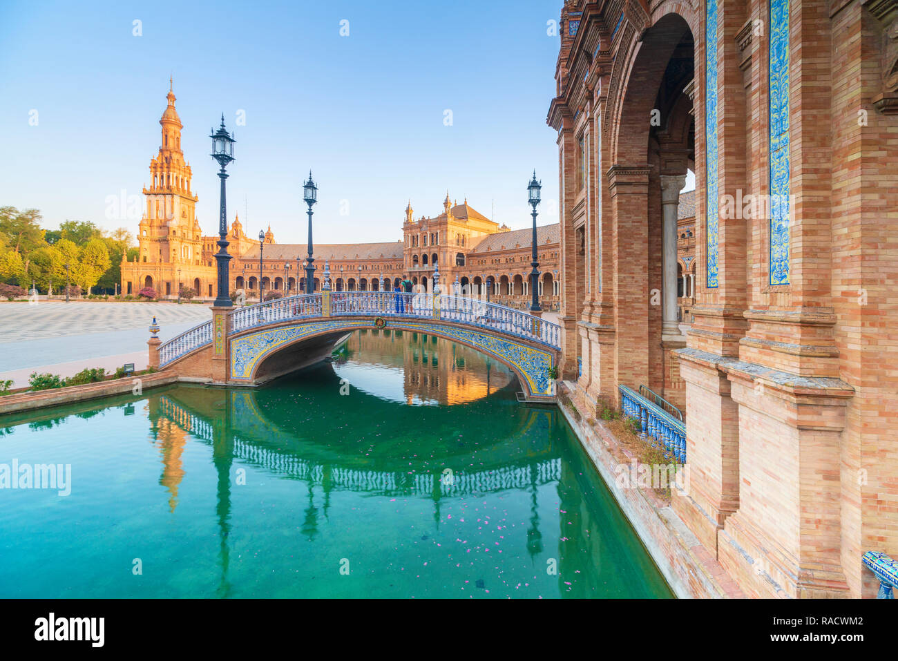 Arch bridge in Art Deco style along the canal, Plaza de Espana, Seville ...
