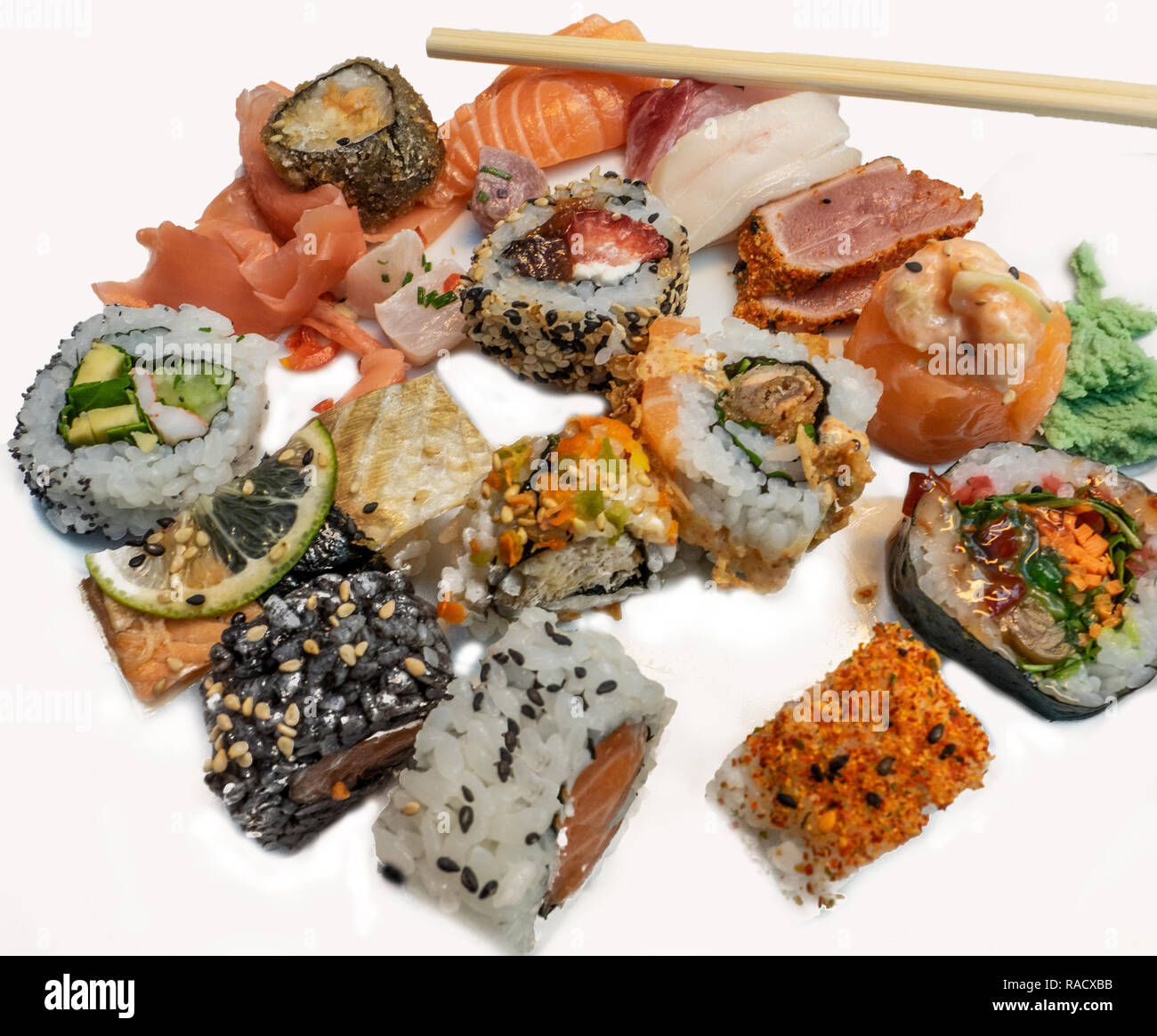 different varieties of fresh sushi on a white background Stock Photo ...