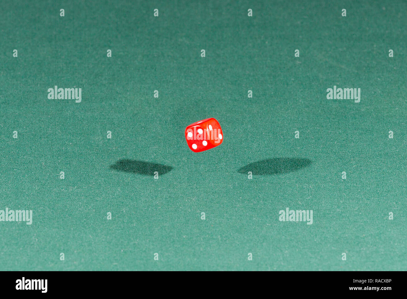 Red dice falling bouncing hi-res stock photography and images - Alamy