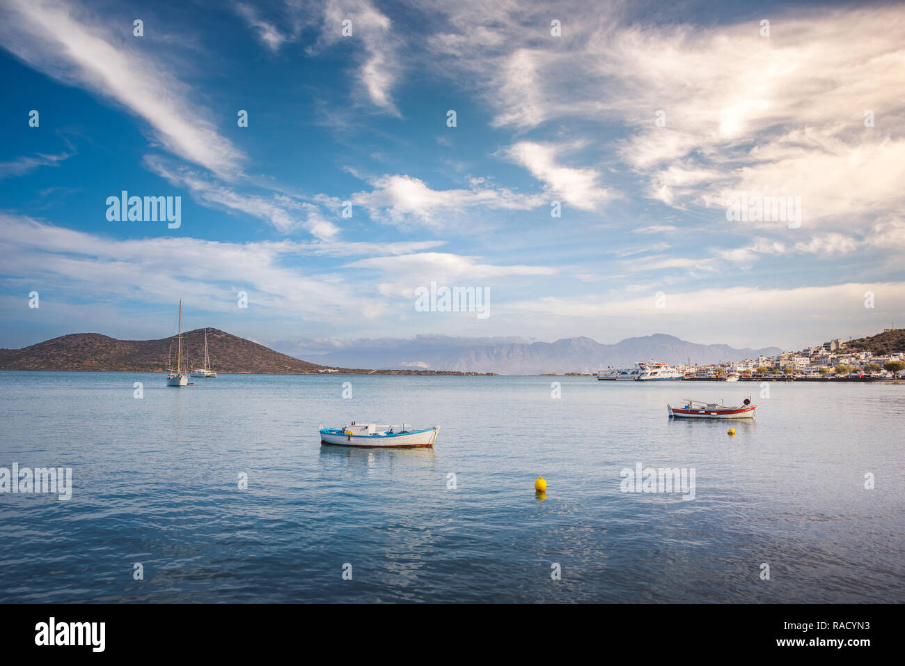 The small harbor of Plaka with traditional fishing boatsnear Elounda ...