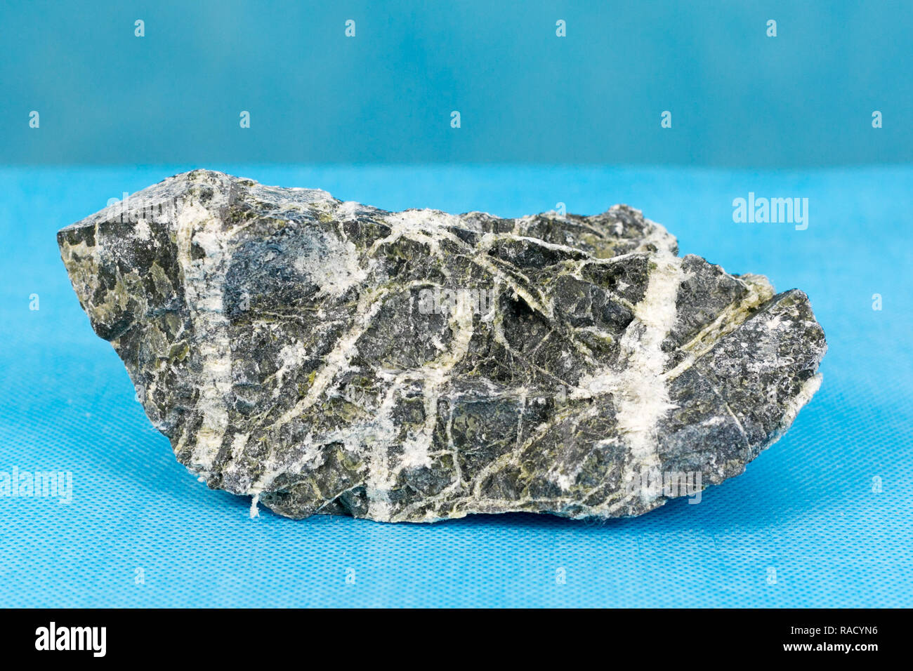 Mineral asbestos in the composition of the stone enclosing rock Stock ...