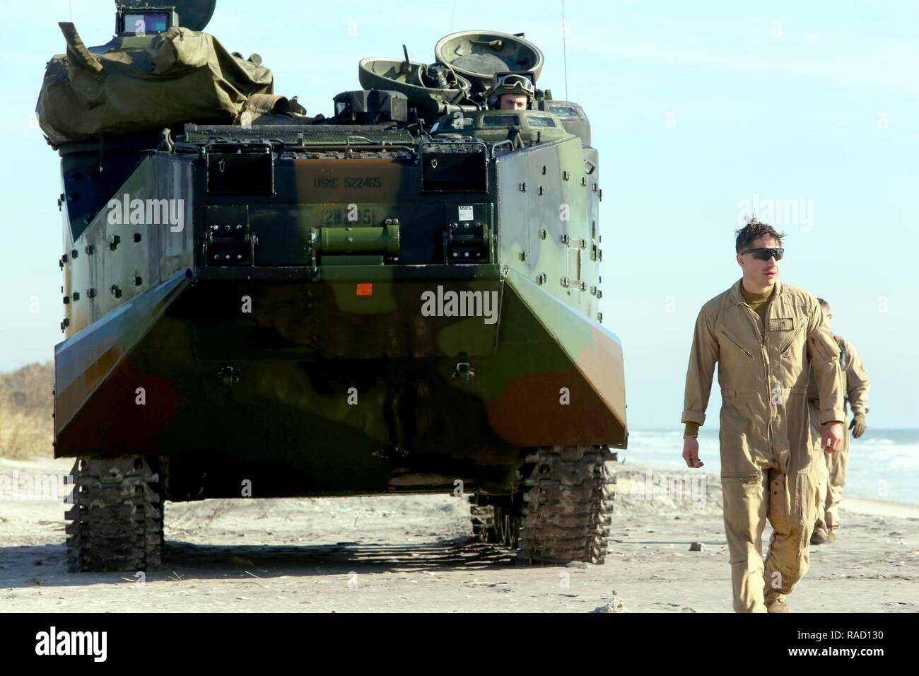Sgt. Kevin M. Powers ground guides the operator of an assault ...