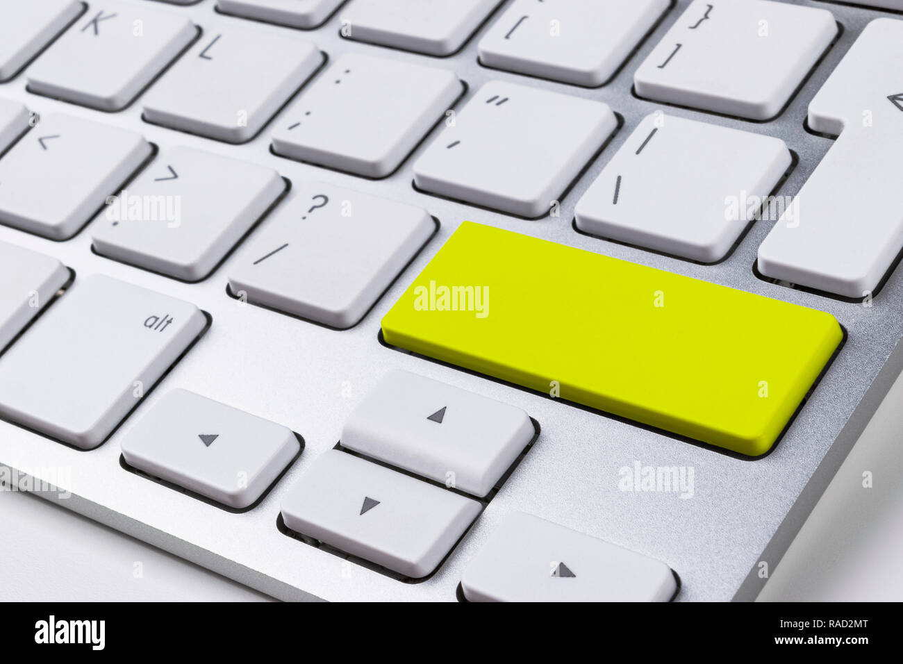 Close up view of a Computer notebook keyboard with one yellow button on ...
