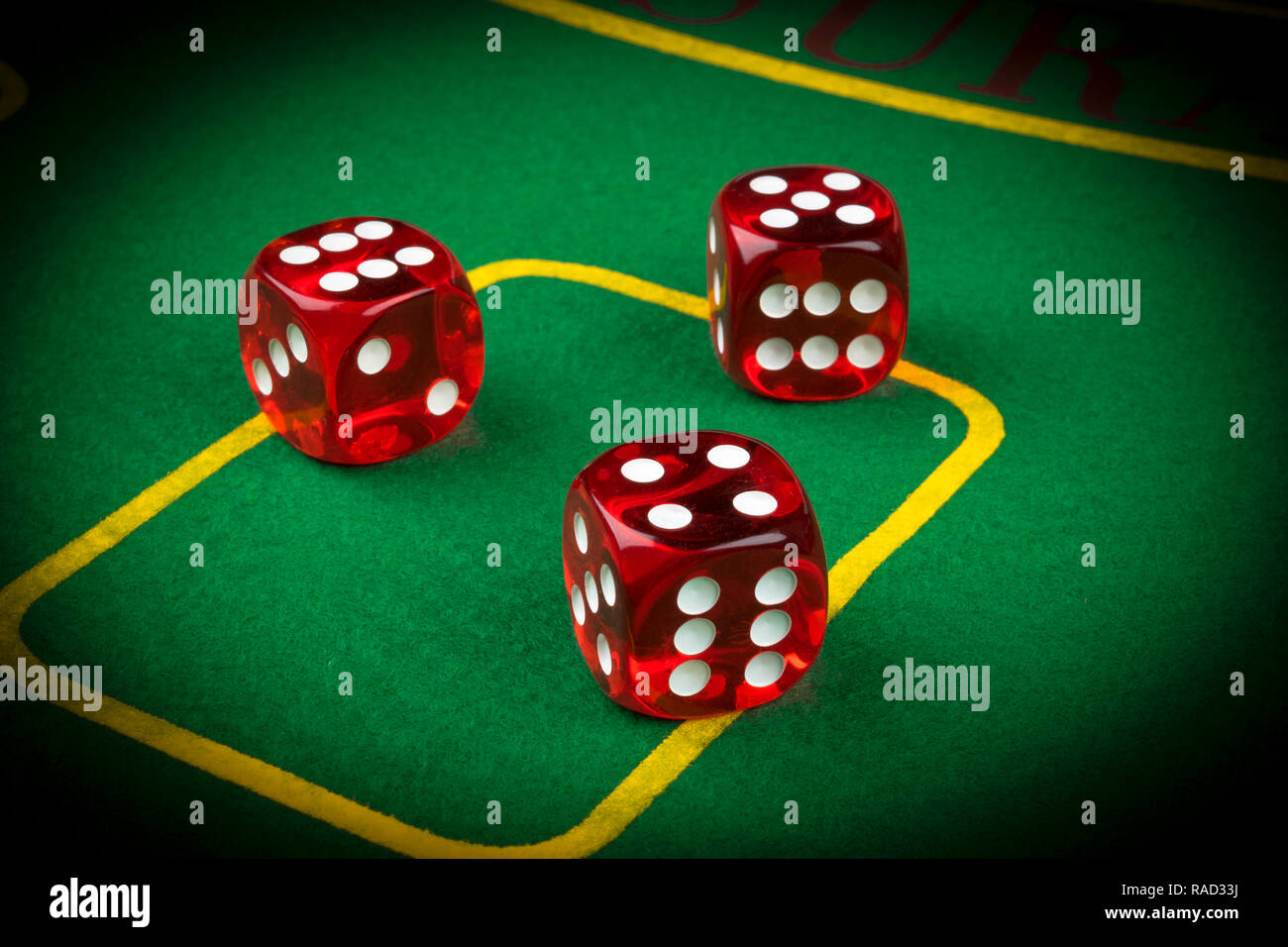 risk concept - playing dice on a green gaming table. Playing a game ...