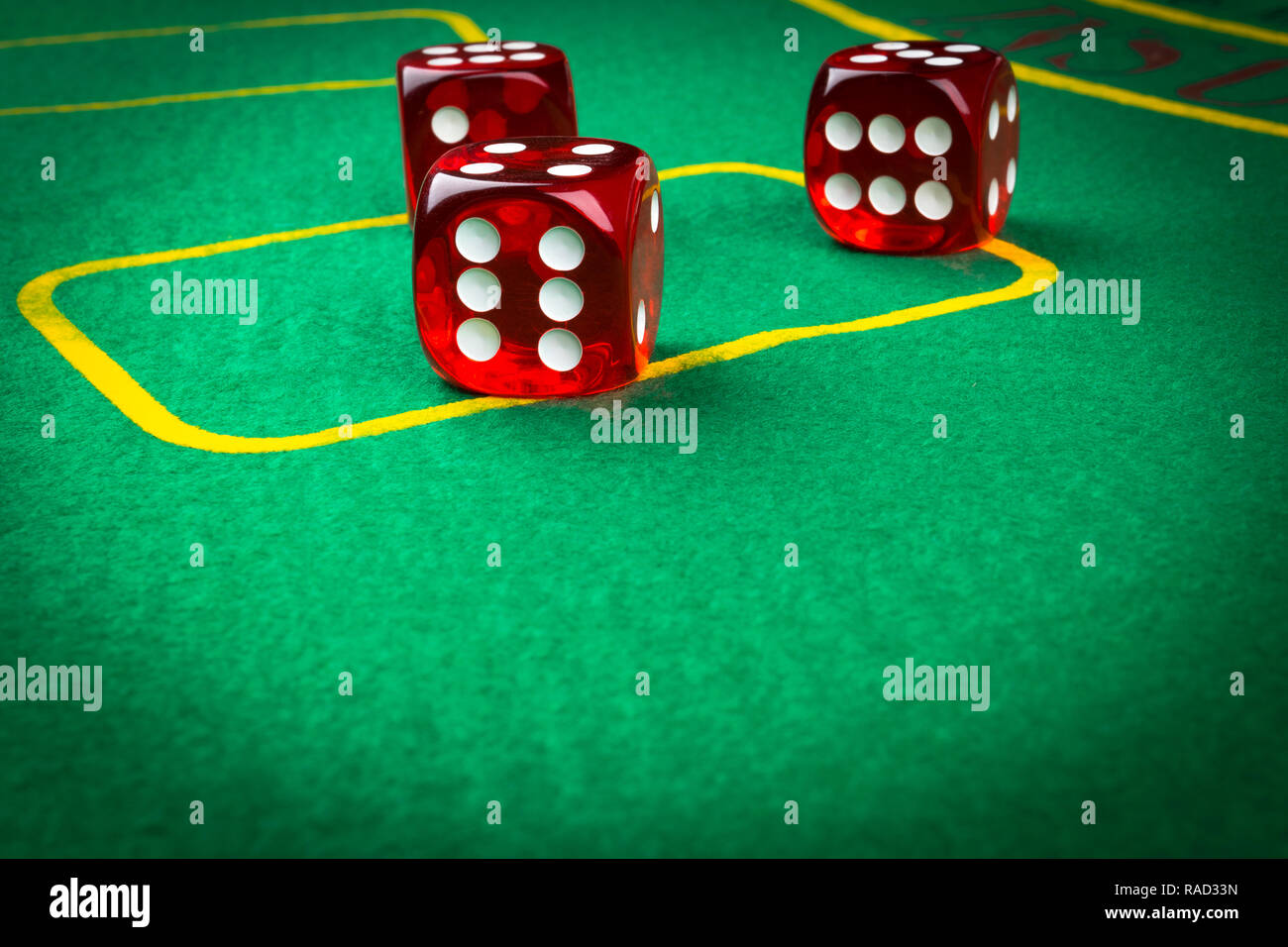 risk concept - playing dice on a green gaming table. Playing a game ...