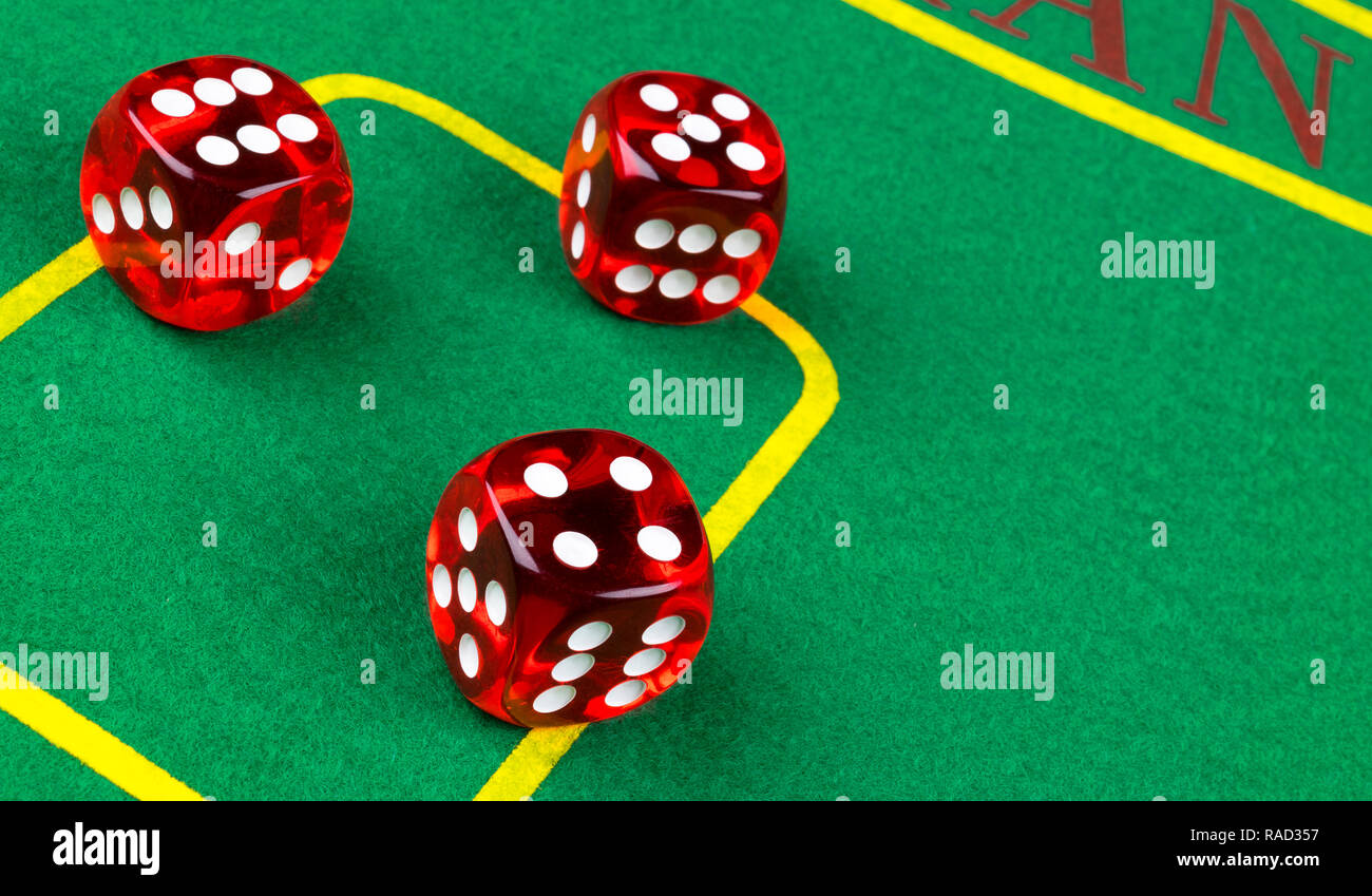 risk concept - playing dice on a green gaming table. Playing a game ...