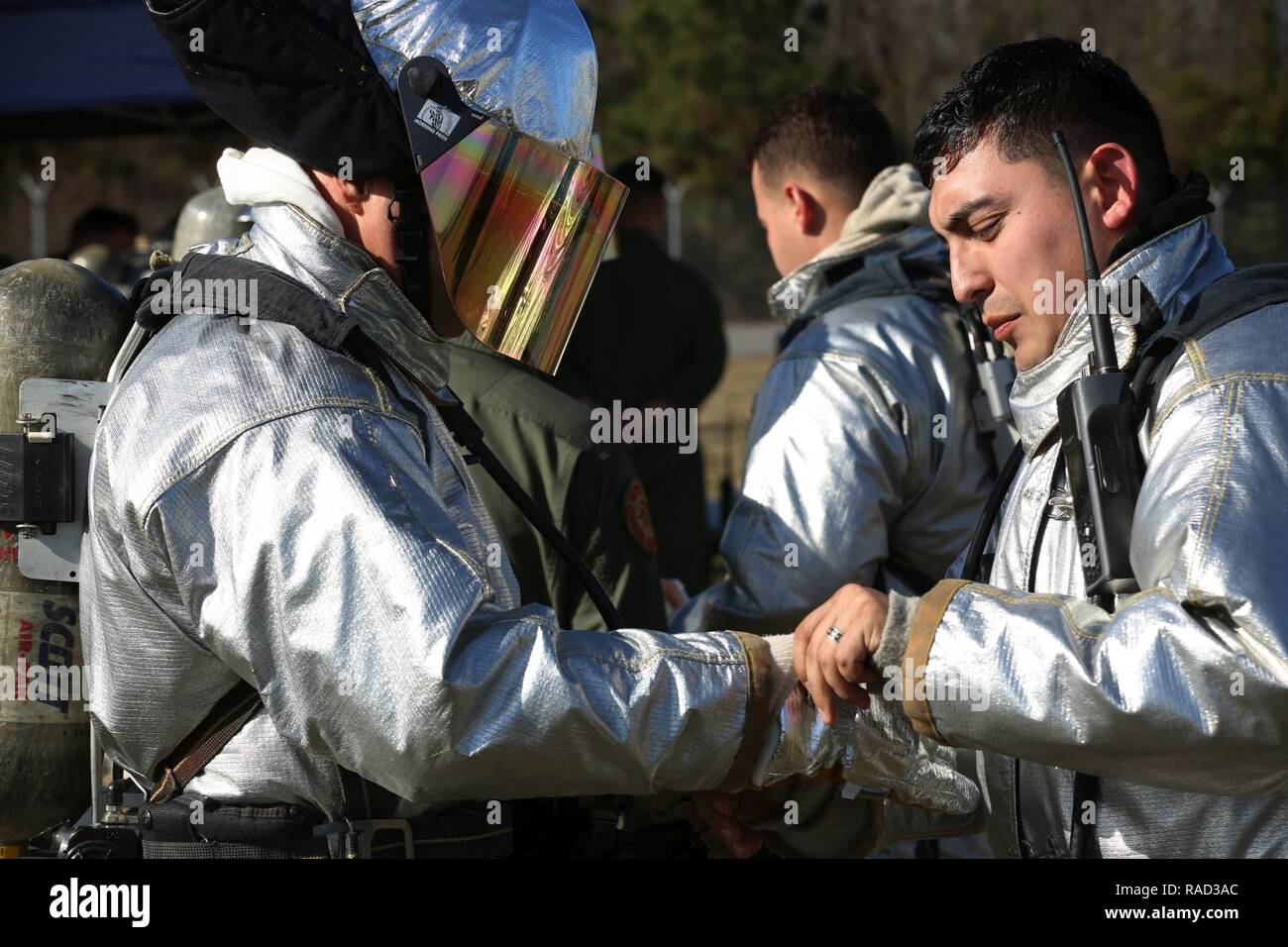 Cpl. Noah Rios adjusts Sgt. Maj. Charles Metzger’s gear during a live ...