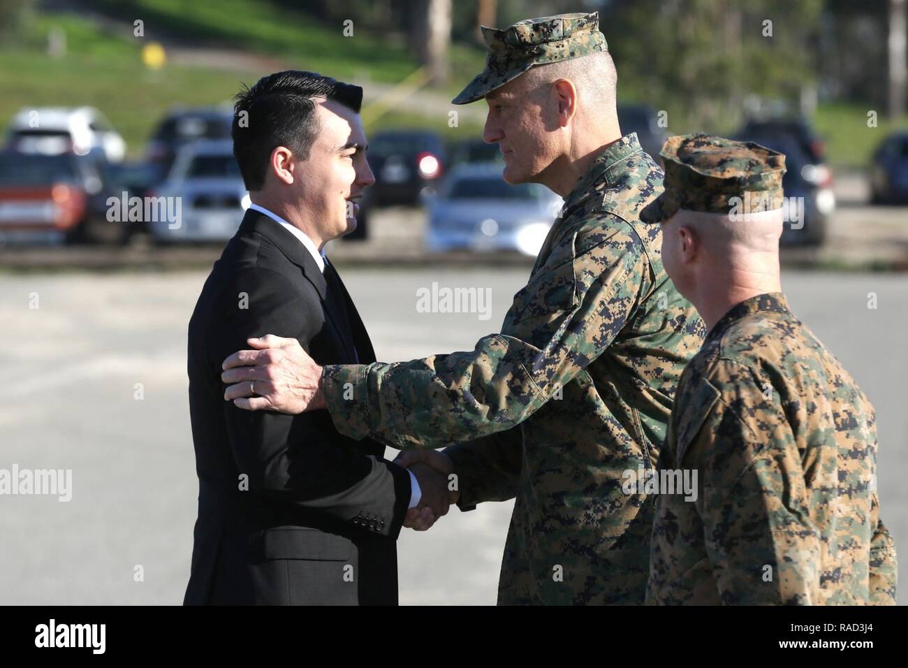 Sgt. Zachary L. Piepenhagen (left), shakes hands with Maj. Gen. David ...