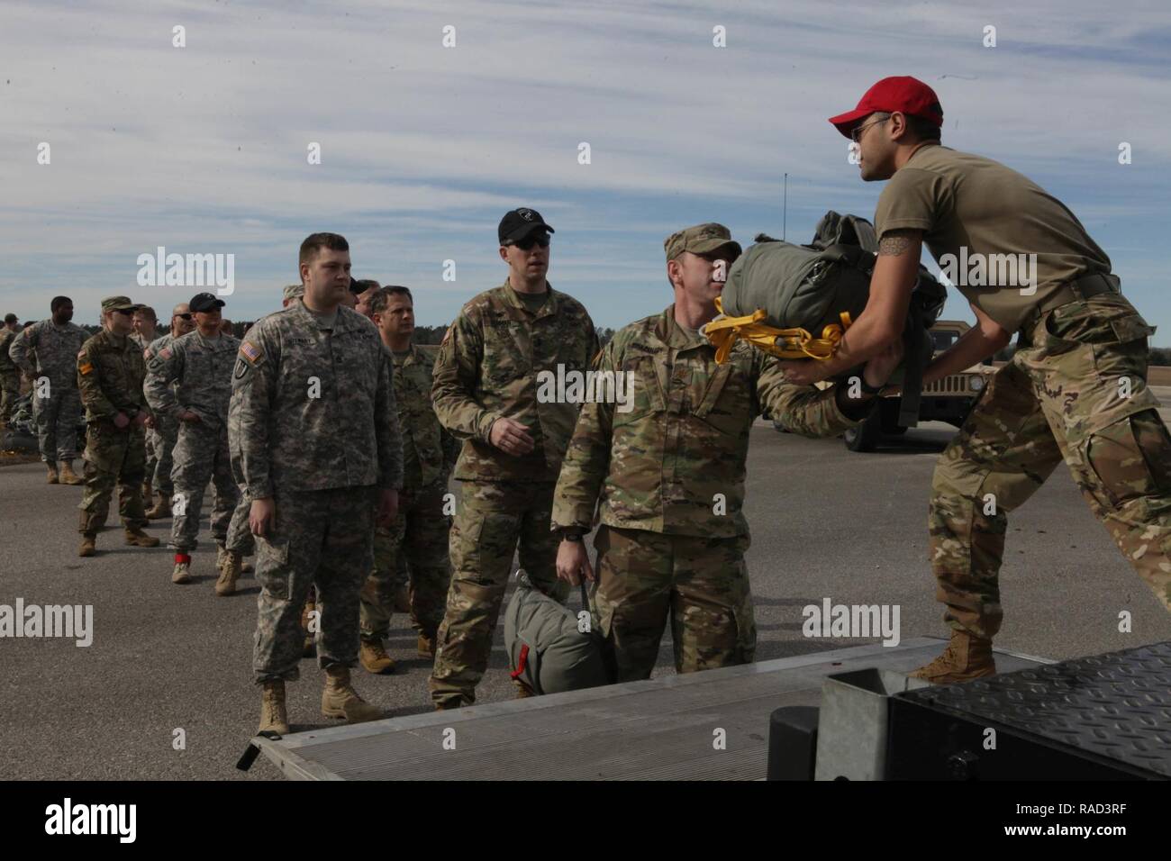 A U.S. Army rigger assigned to the 360th Civil Affairs Brigade issues a ...