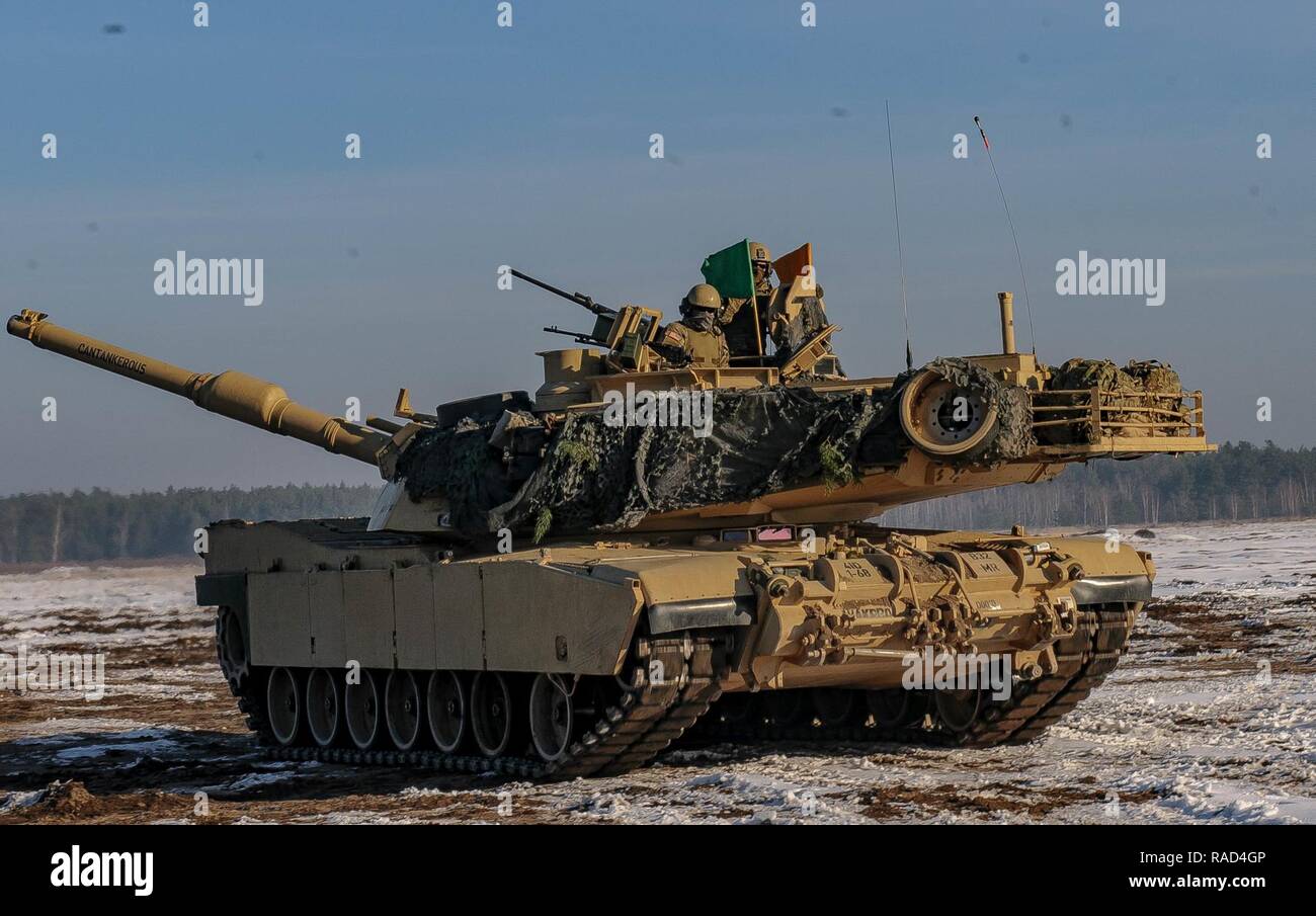 A tank crew in an M1A2 Main Battle Tank belonging to 1st Battalion ...