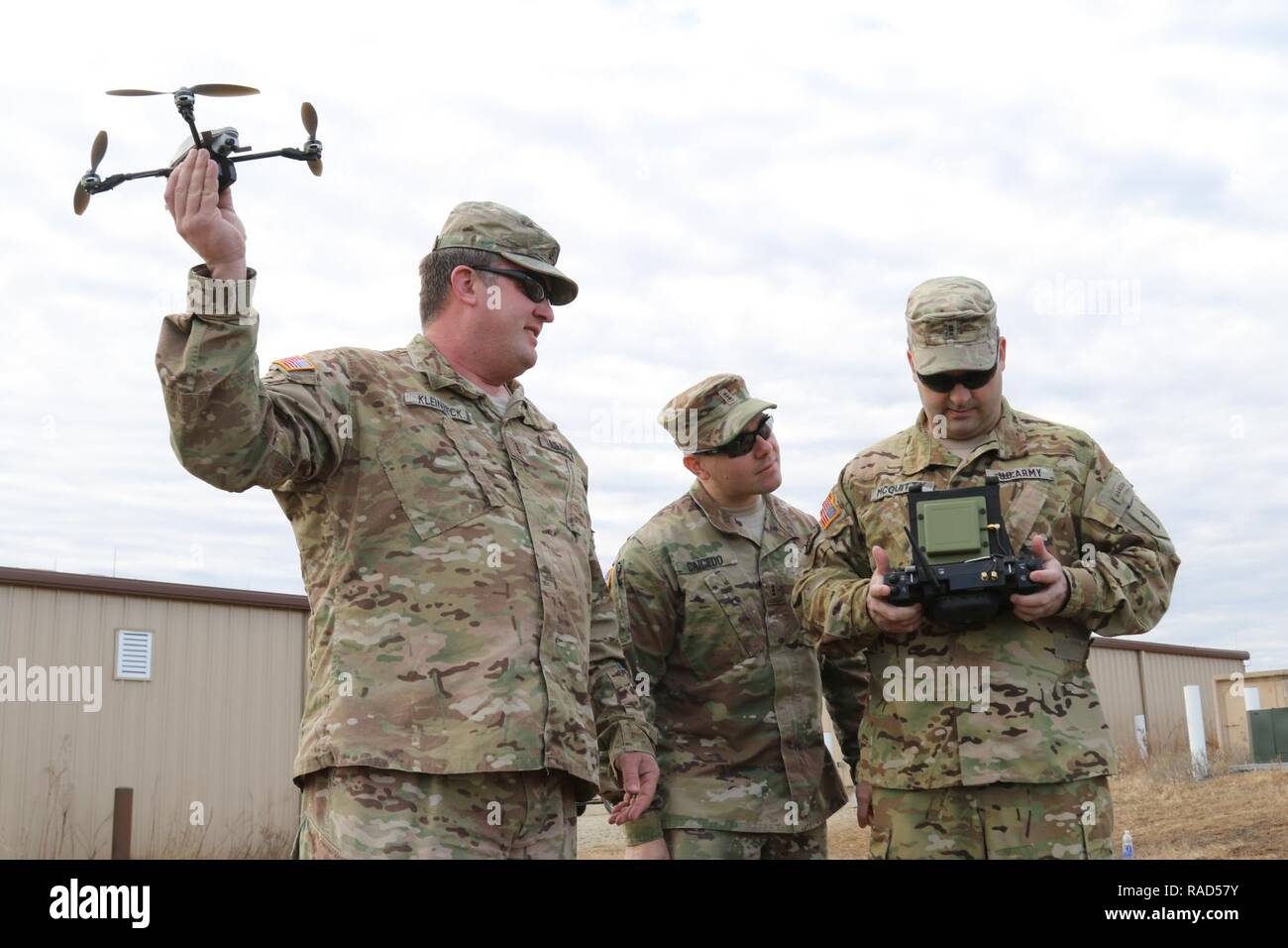 Chief Warrant Officer 4 Samuel Kleinbeck (left), tactical unmanned ...