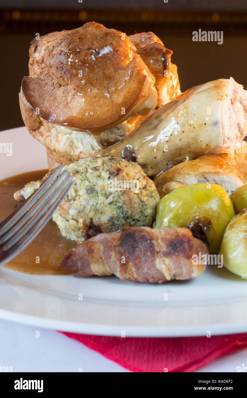 A popular British roast Chicken Sunday dinner with Yorkshire pudding ...