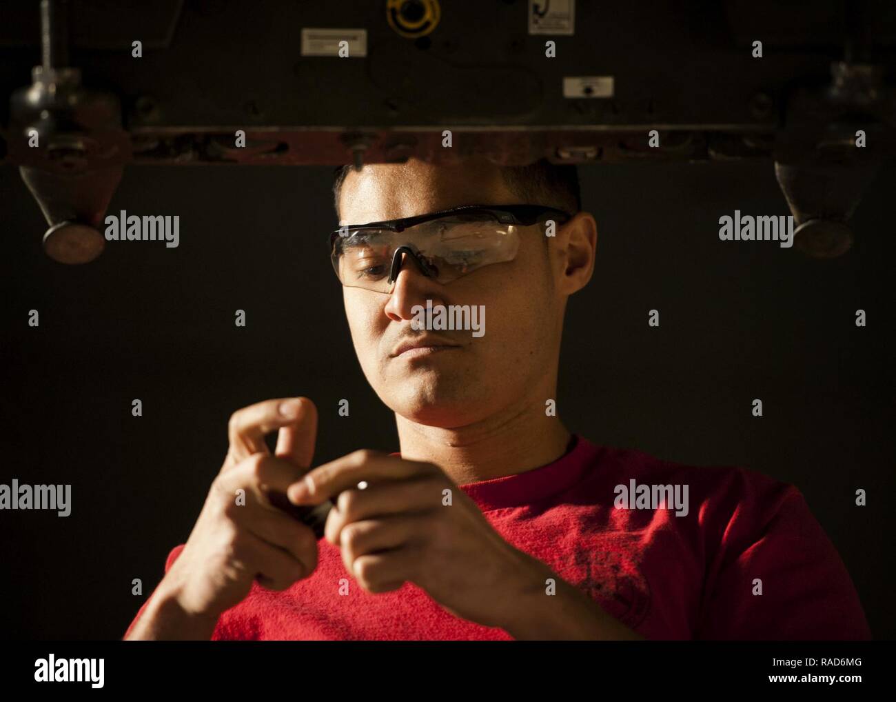 Staff Sgt. Ross Escobar, 23rd Aircraft Maintenance Unit weapons load ...