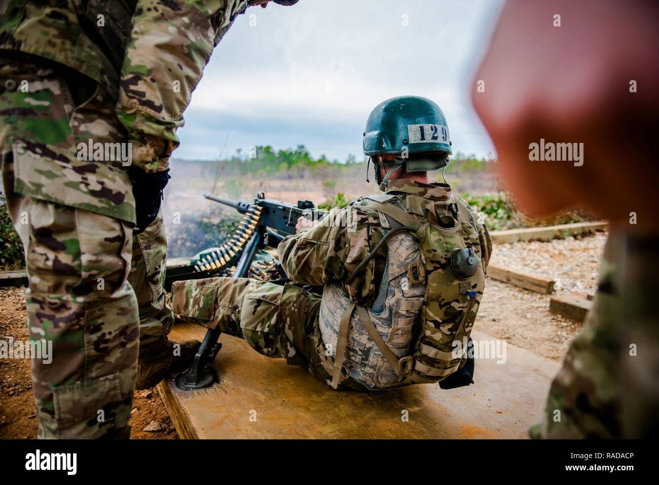 (FORT BENNING, GA) - A trainee fires the M2 from the seated, tripod ...
