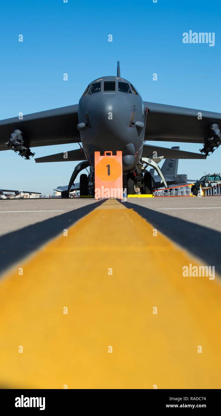 A B-52 Stratofortress awaits loading of live munitions onto its latest ...