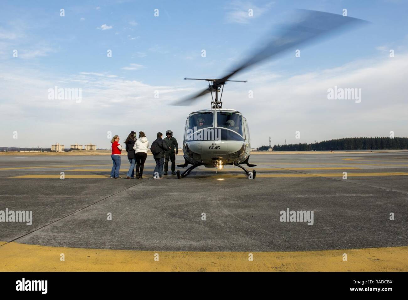 Participants of a Spouse Orientation Flight board a UH-1N Iroquois Feb ...