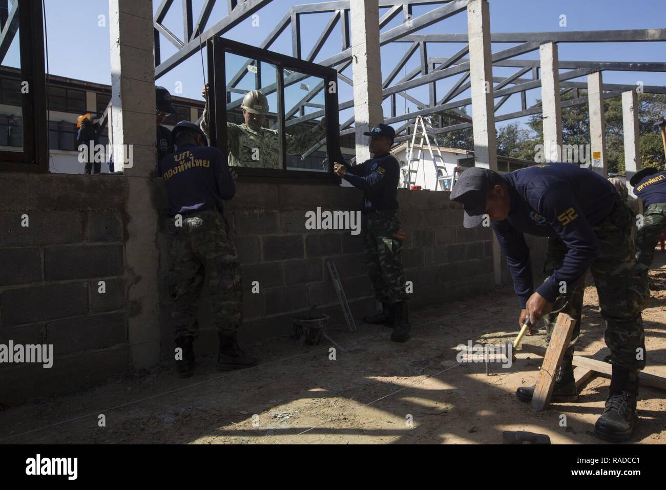 U.S. Navy Builder 1st Class Fabian Flores, with Naval Mobile ...