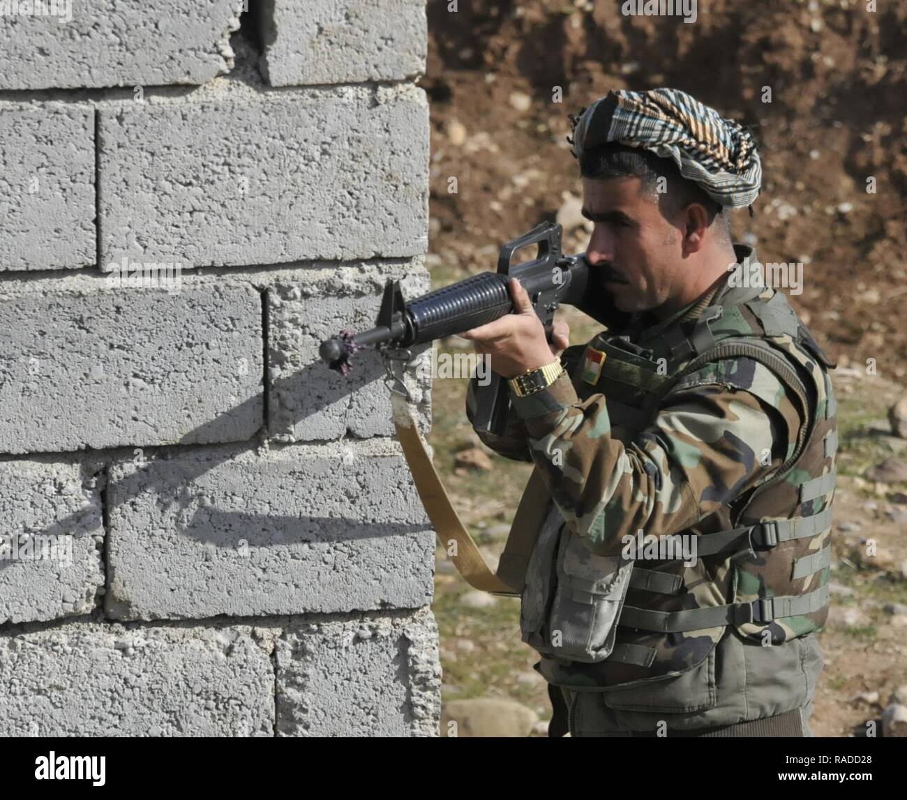 A Peshmerga soldier stands guard during urban operations training near ...